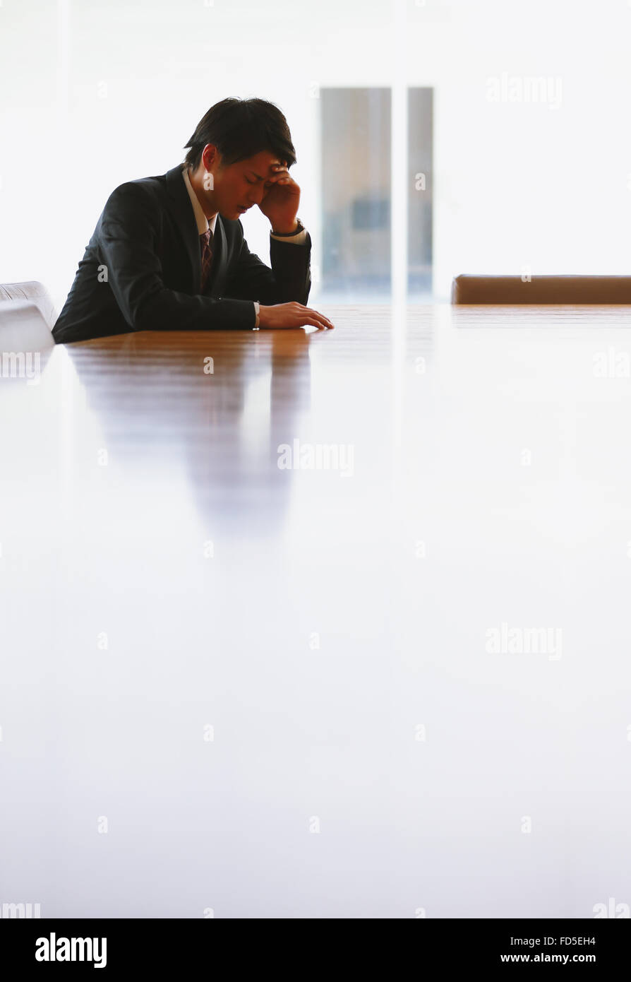 Tired Japanese businessman Stock Photo - Alamy