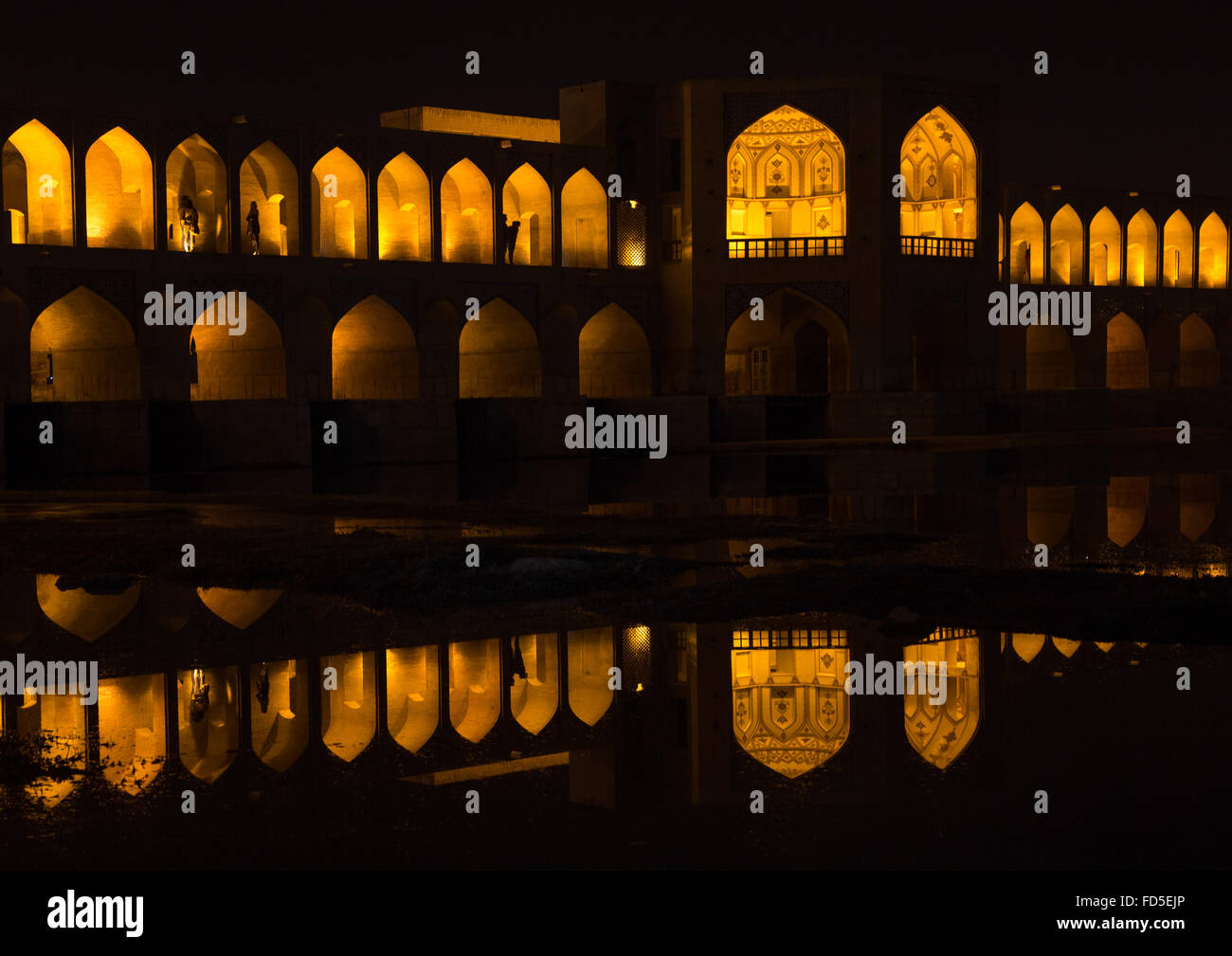 a view of the khaju bridge at night highlighting the arches, Isfahan ...