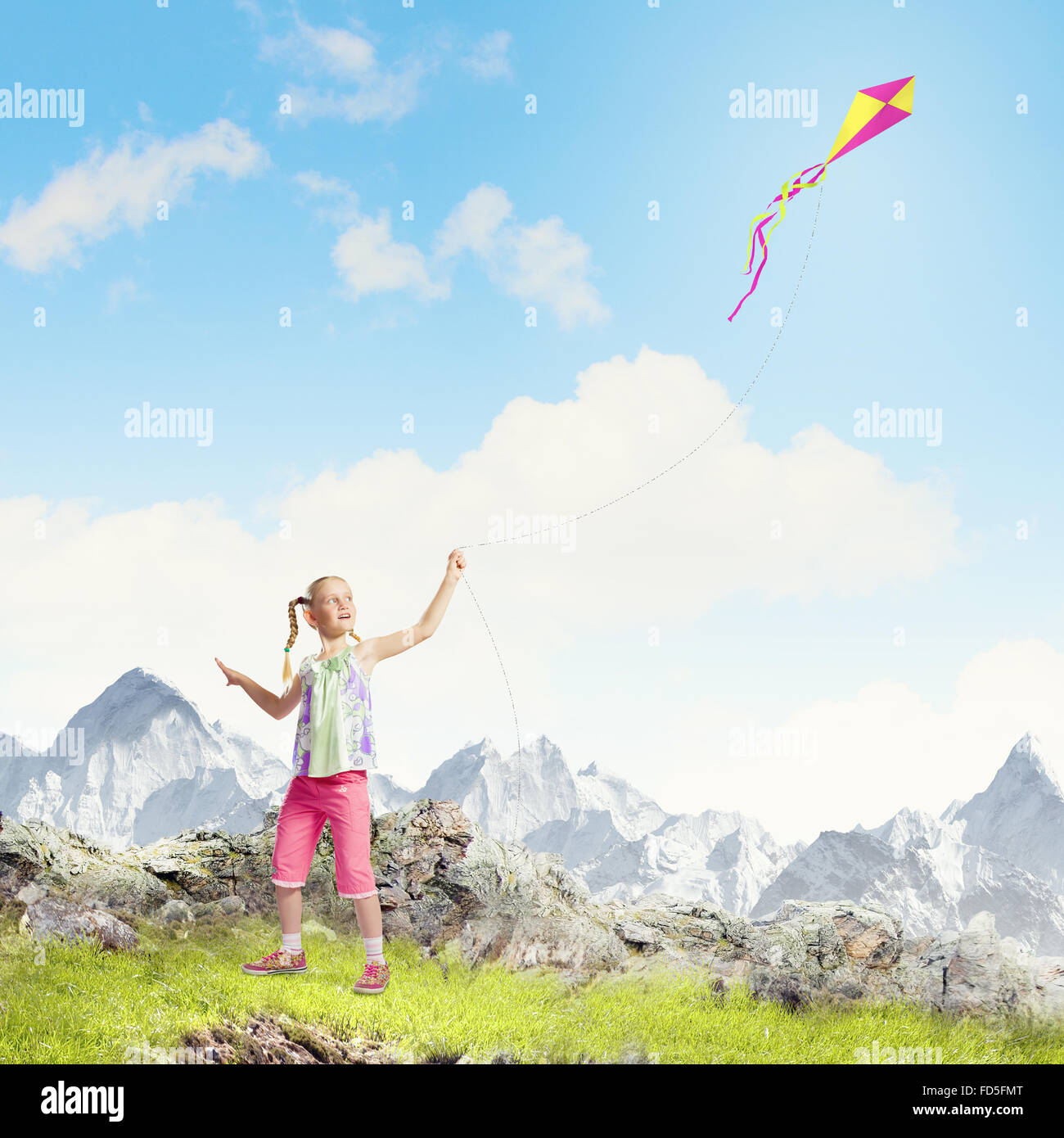 Image of little girl playing with kite at meadow Stock Photo - Alamy
