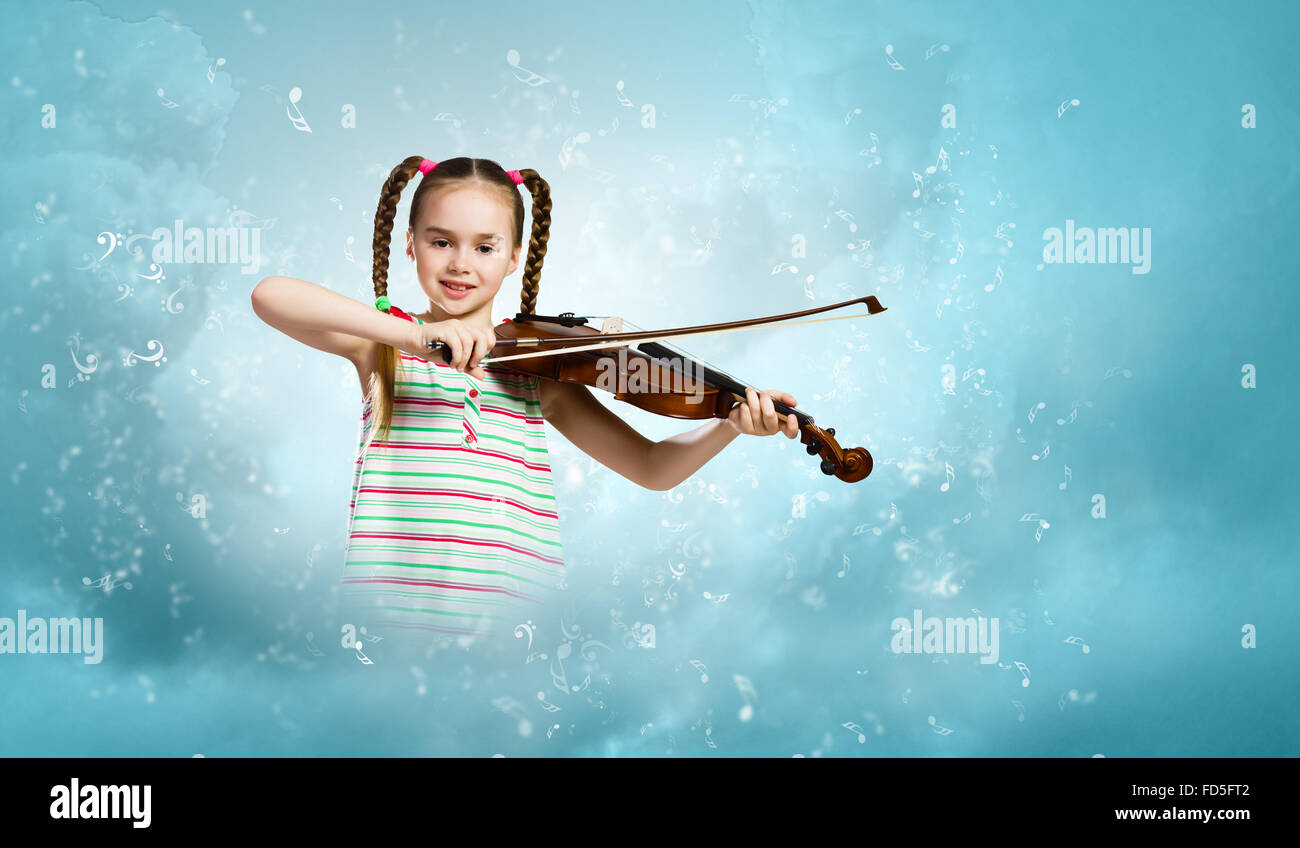 Image of cute girl playing violin against blue background Stock Photo ...