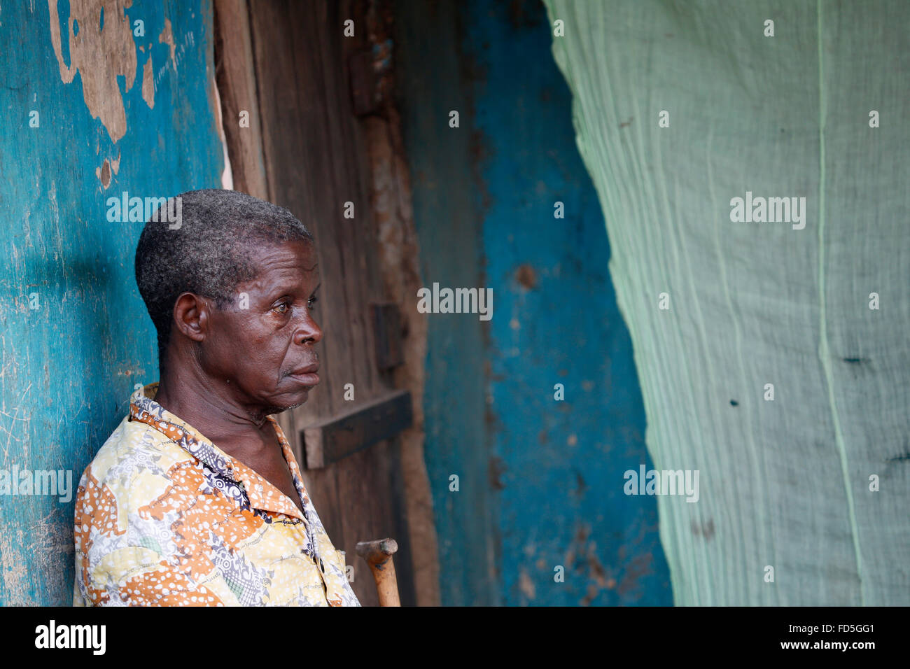 African man in front of his home Stock Photo - Alamy