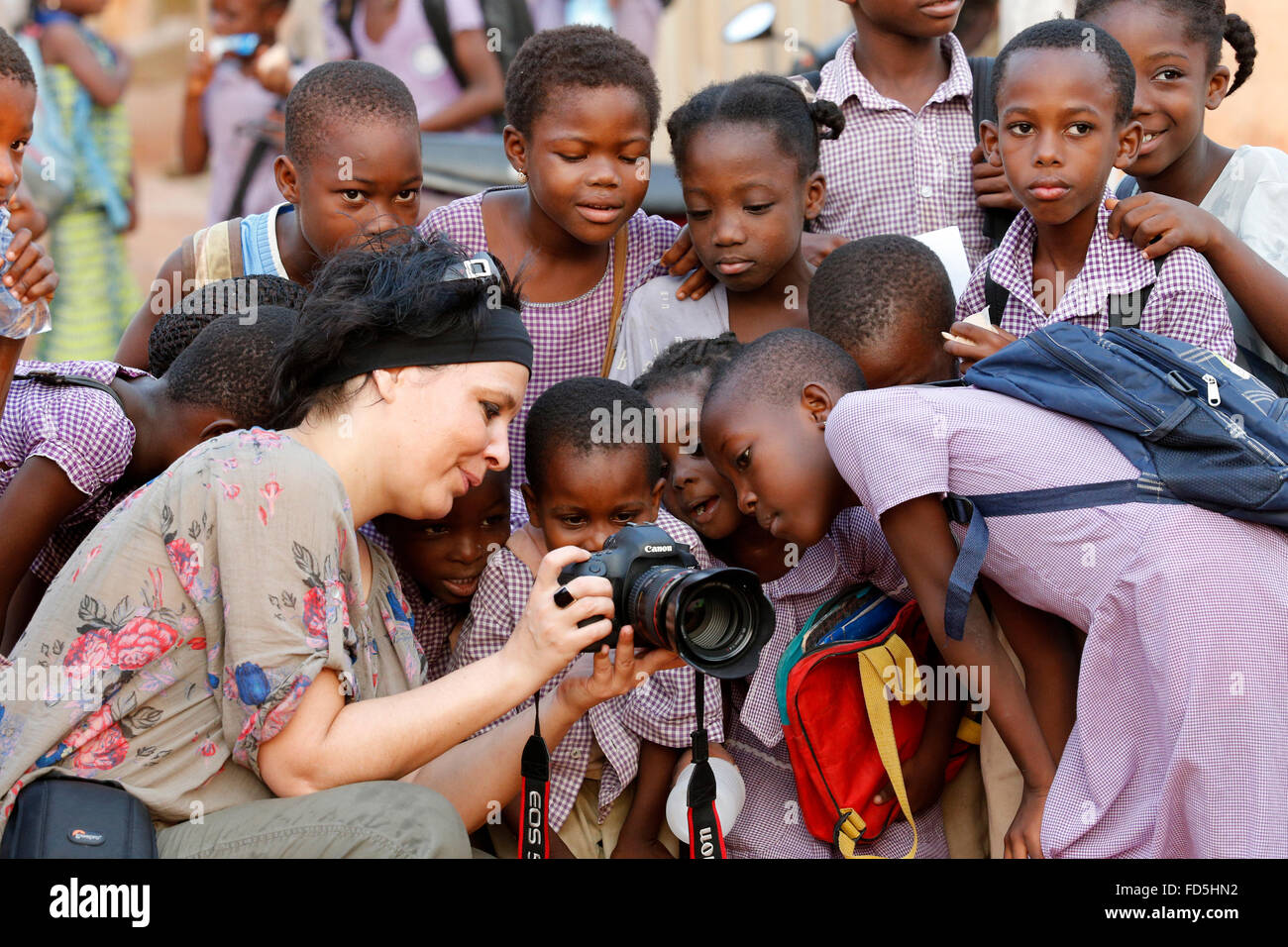 Photographer with African pupils Stock Photo - Alamy