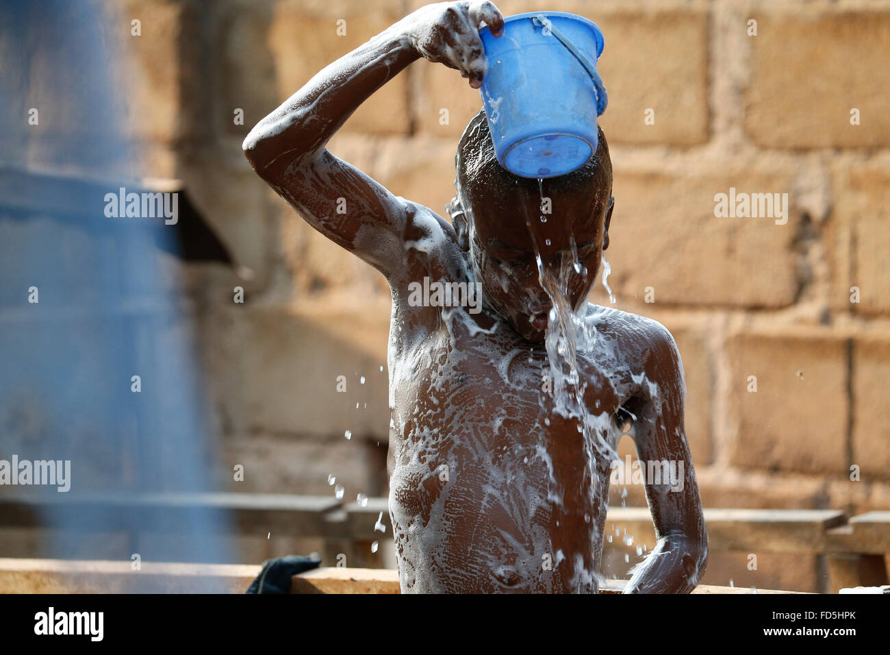 African child having a shower at home Stock Photo - Alamy
