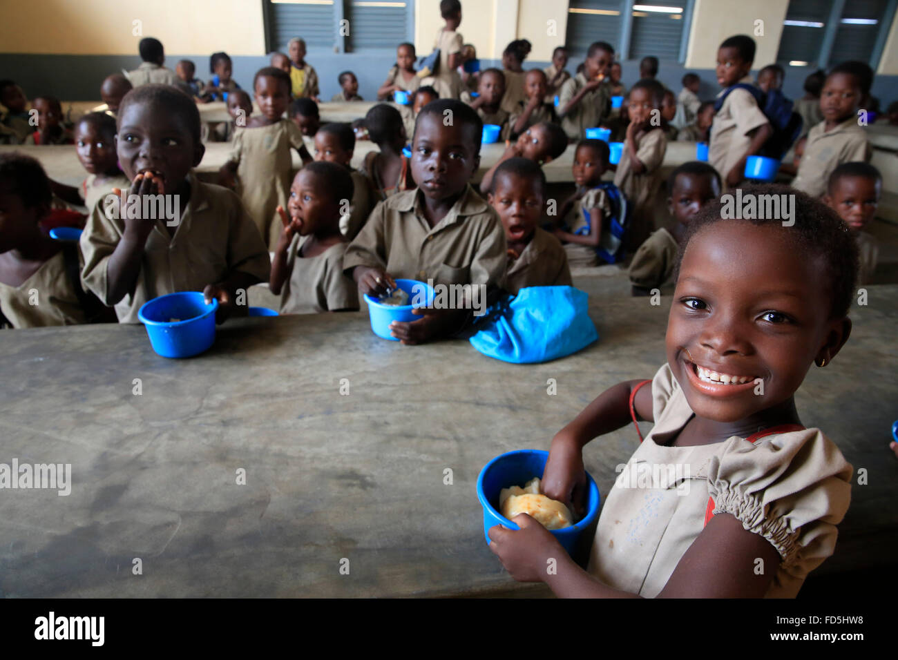 Food distribution in an African primary school Stock Photo - Alamy