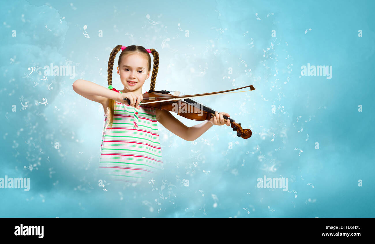 Image of cute girl playing violin against blue background Stock Photo ...