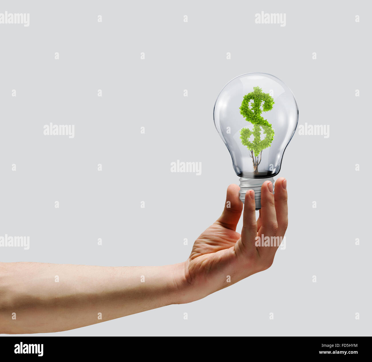 Human hand holding bulb with money tree inside. Wealth concept Stock ...