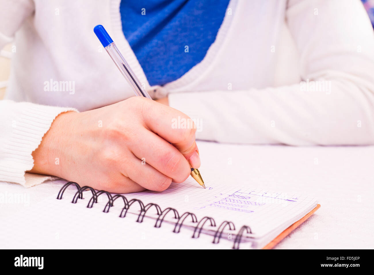 Business Woman Writing with pen in notepad Stock Photo - Alamy