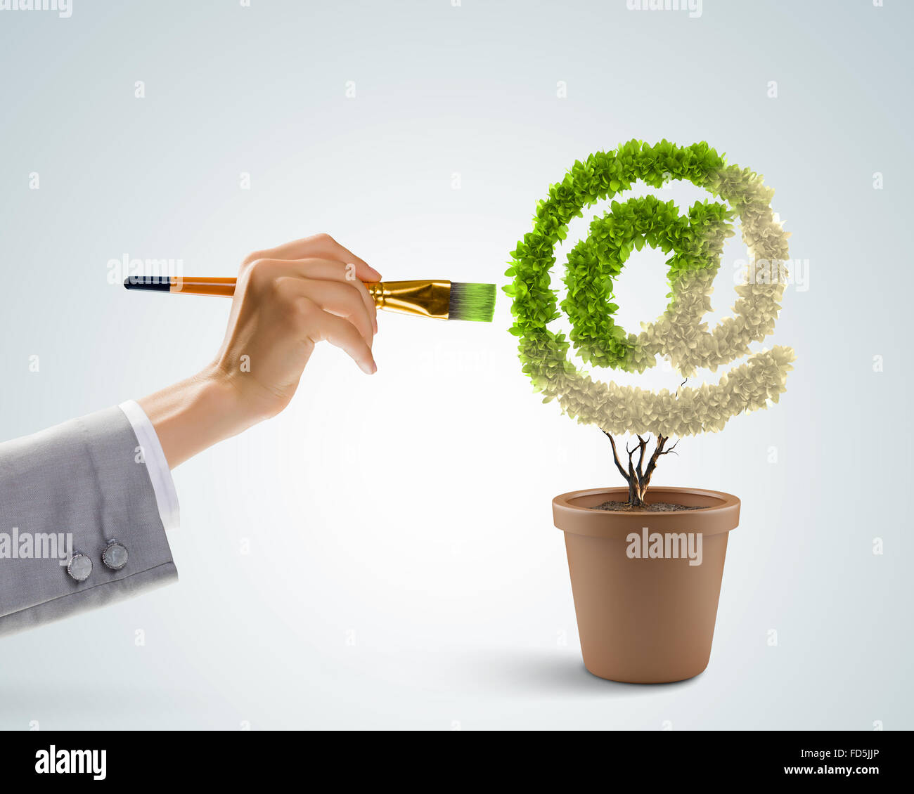 Close up image of human hand painting plant Stock Photo - Alamy