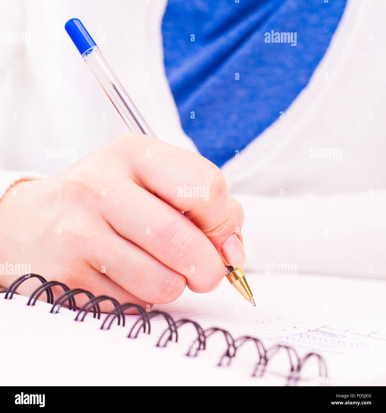 Business Woman Writing with pen in notepad Stock Photo - Alamy
