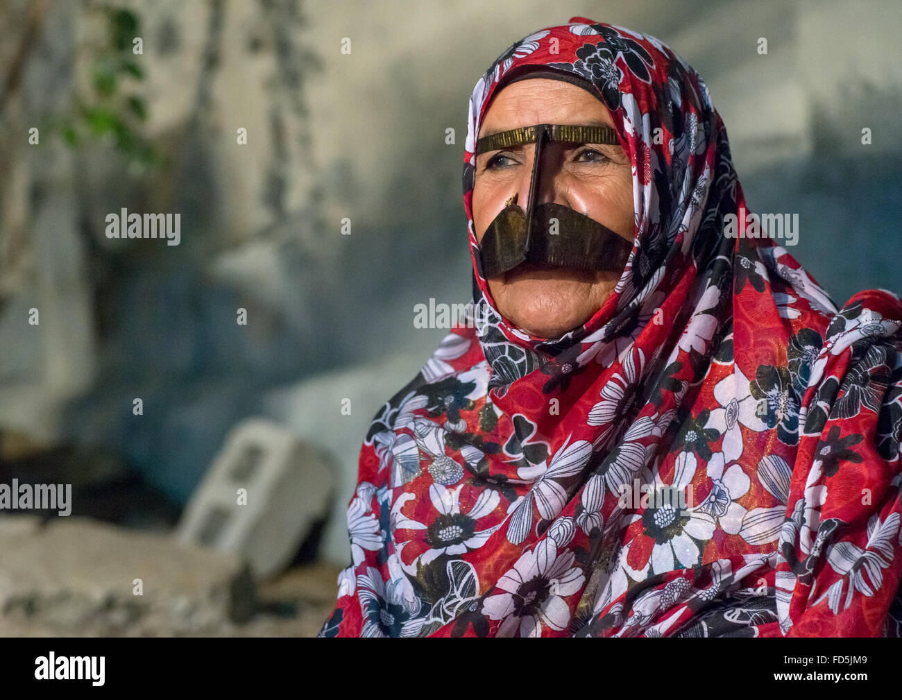 a bandari woman wearing a traditional mask called the burqa, Qeshm ...