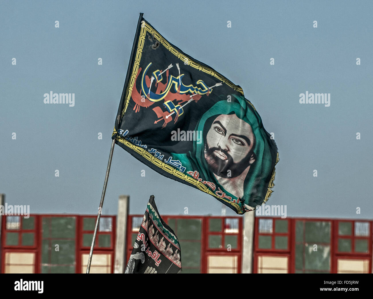 Flag in Basra proclaiming support for Imam Husayn Stock Photo - Alamy
