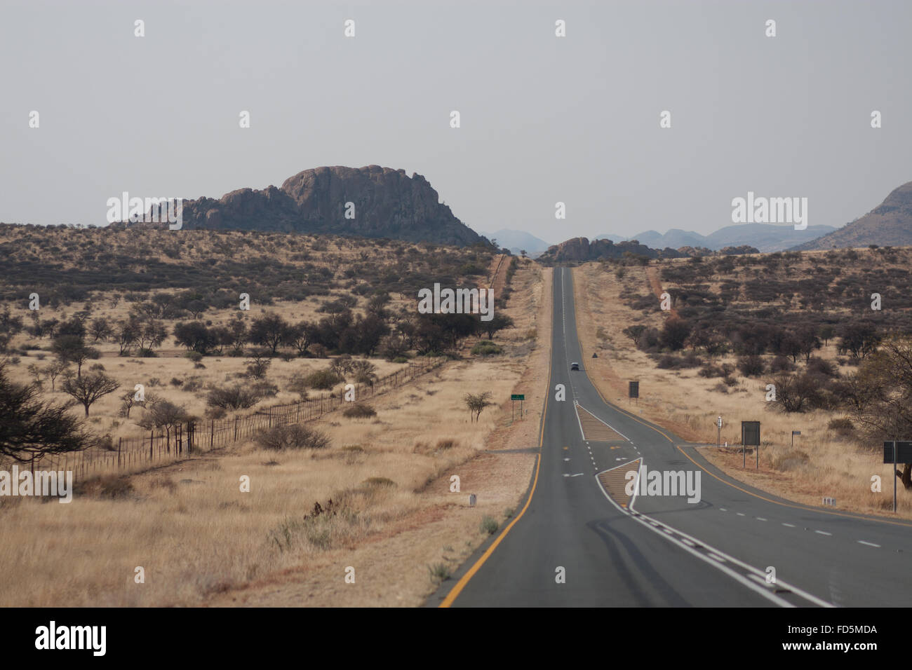 Road Passing Through A Desert Stock Photo - Alamy