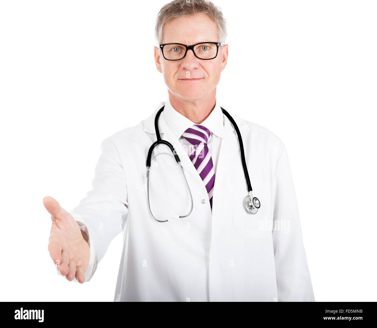 Smiling doctor holding out his hand in a handshake offering his ...