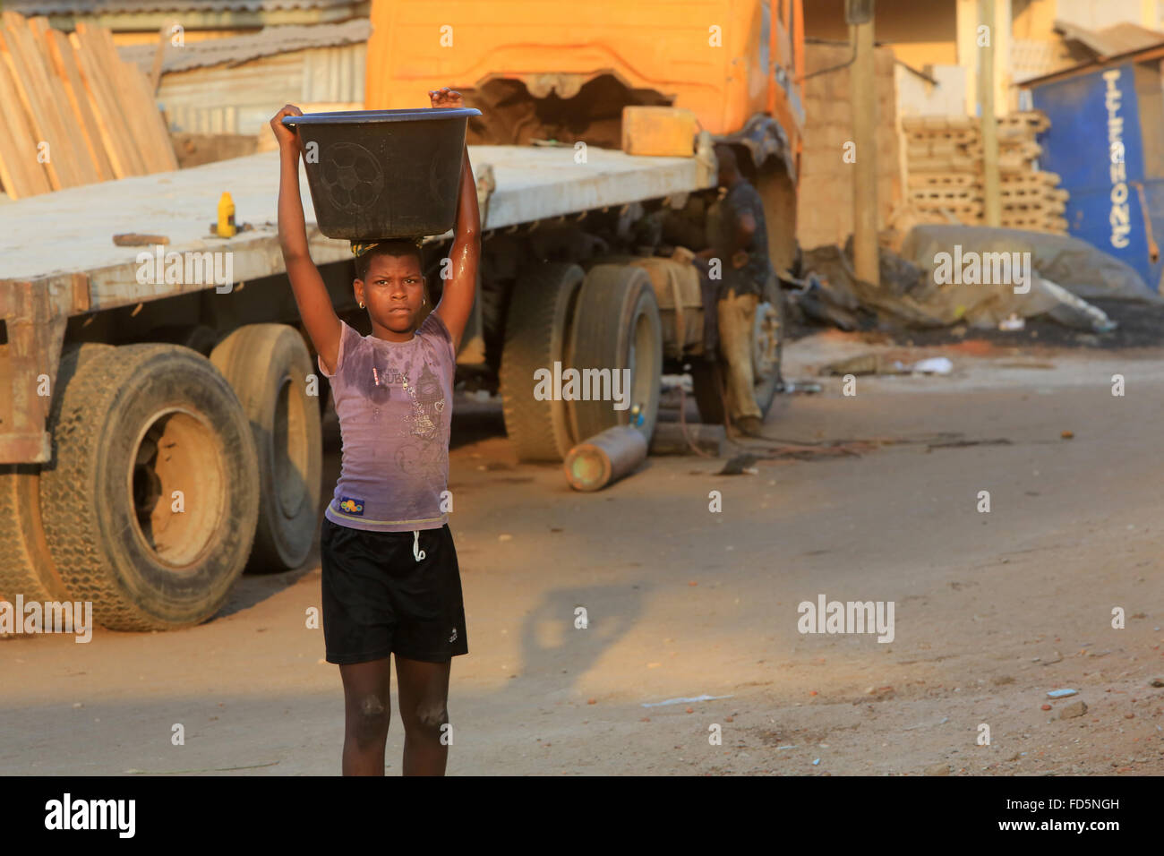 African fetching water with a bucket Stock Photo - Alamy