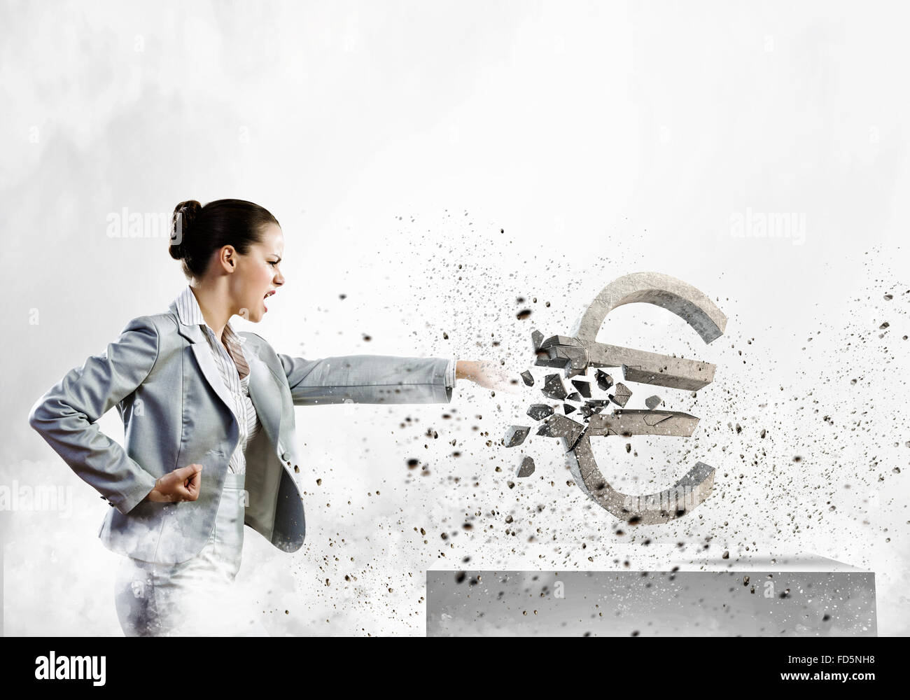 Image of businesswoman crashing stone euro symbol Stock Photo - Alamy