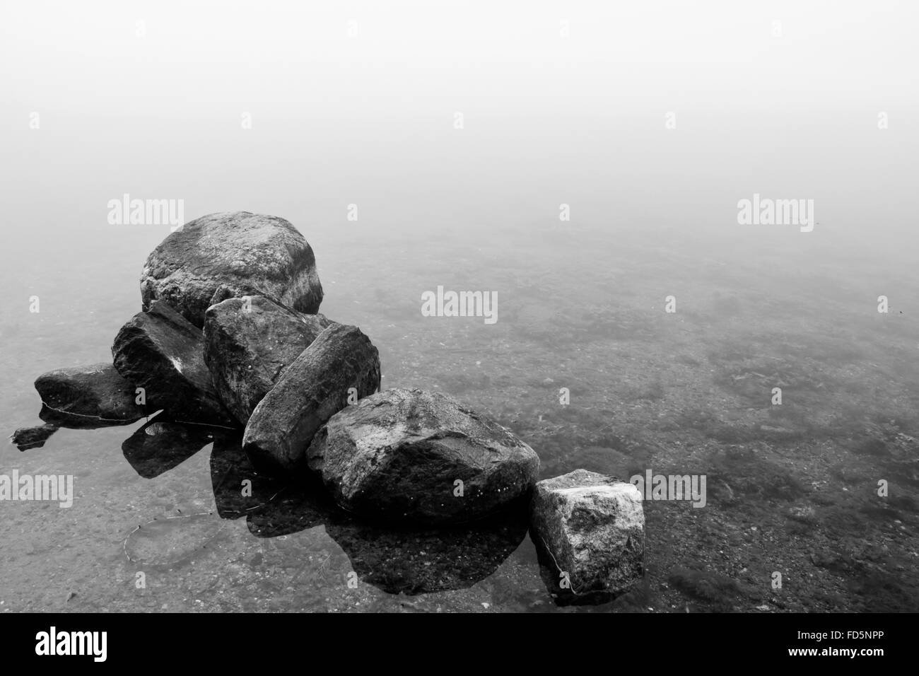 Rocks In Water Stock Photo - Alamy