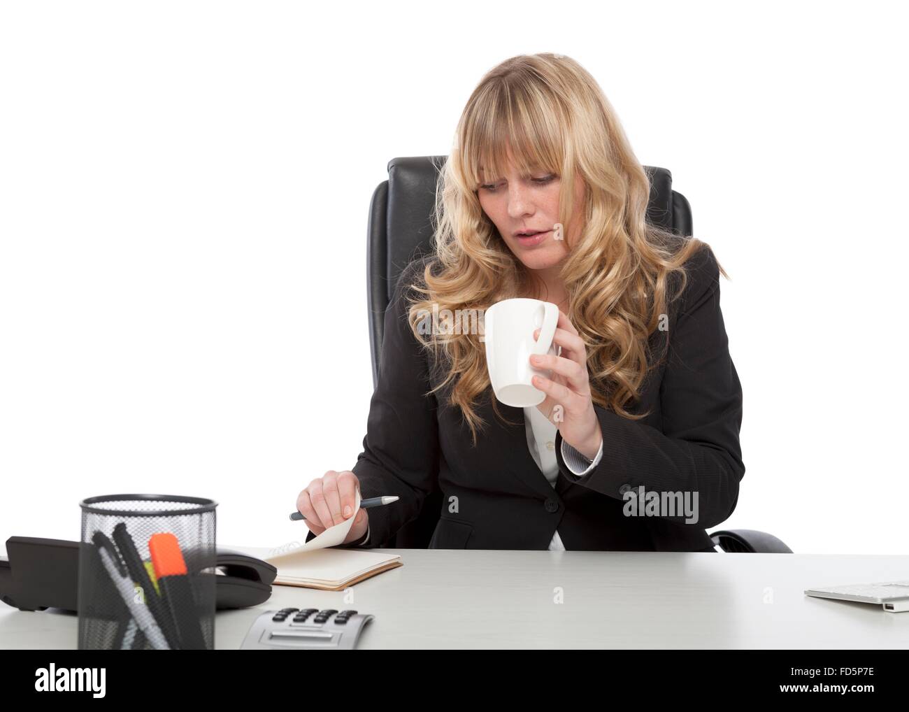 Hardworking Young Businesswoman Quickly Gulping Down A Mug Of Hot