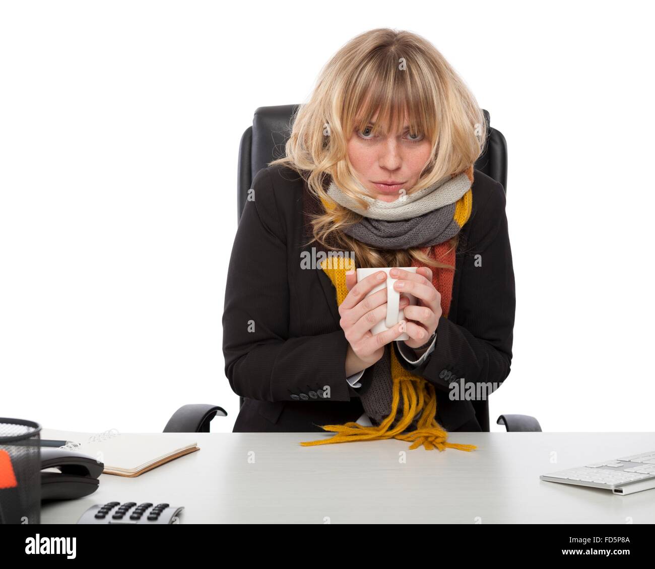 Freezing cold businesswoman wearing a knitted winter scarf sitting ...