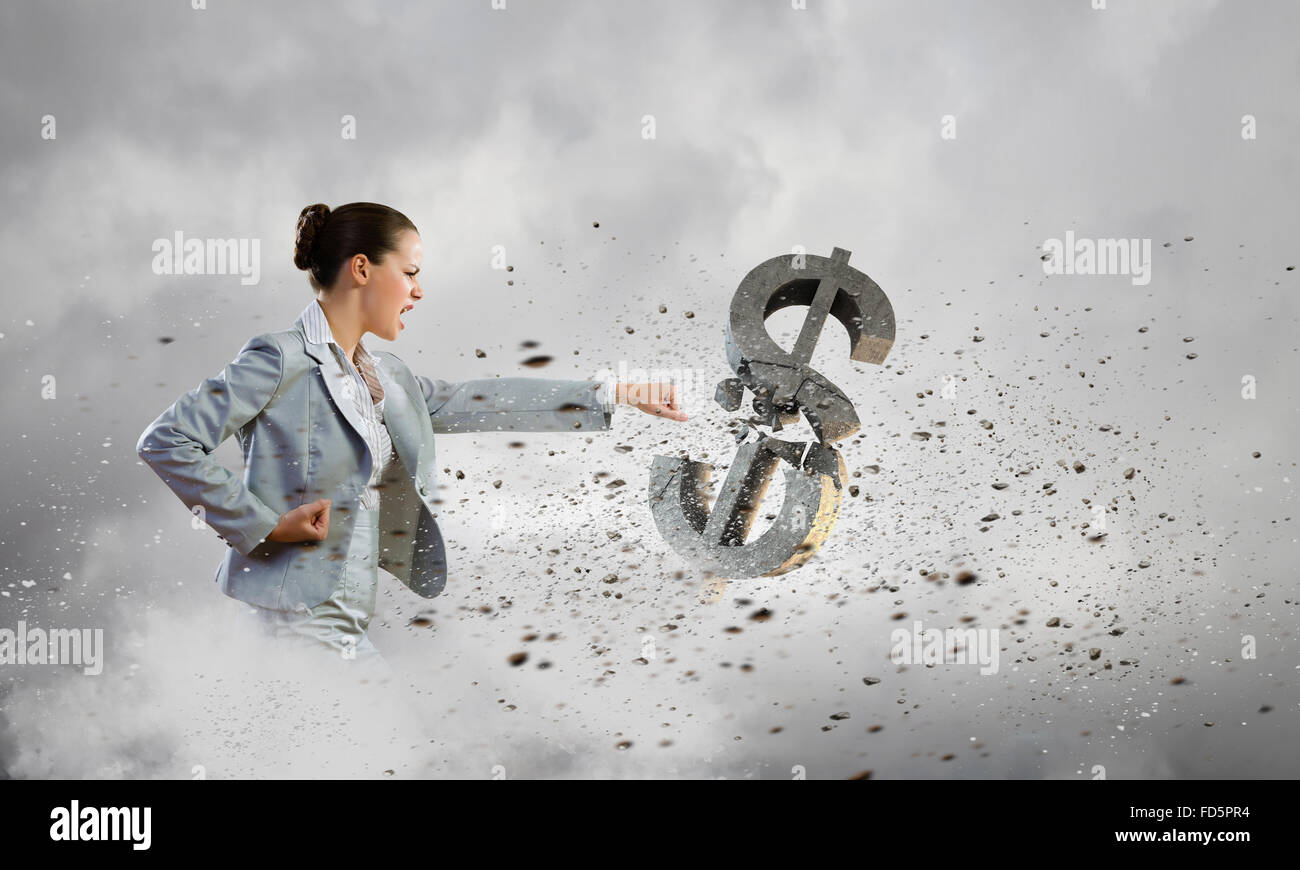Image of businesswoman breaking stone dollar symbol Stock Photo - Alamy