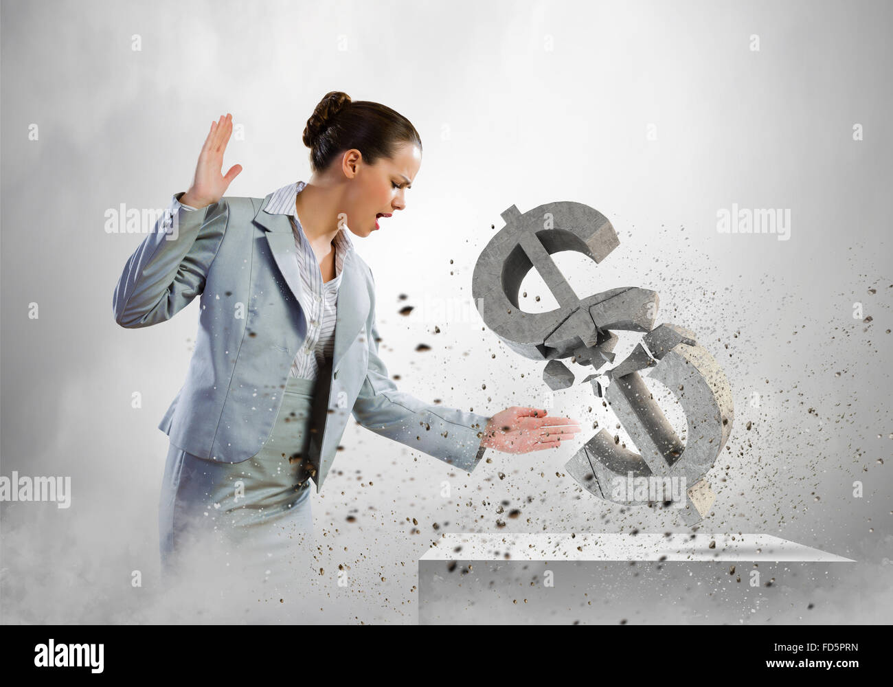 Image of businesswoman breaking stone dollar symbol Stock Photo - Alamy