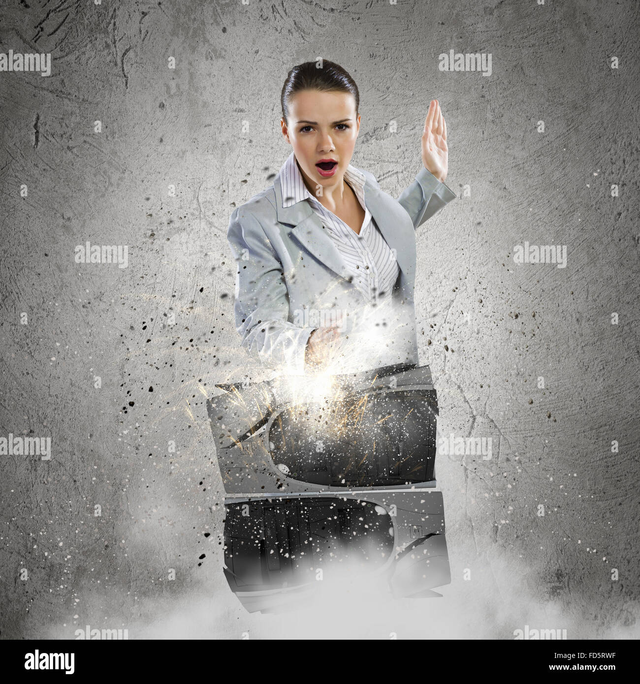 Image of young businesswoman damaging computer processor Stock Photo ...
