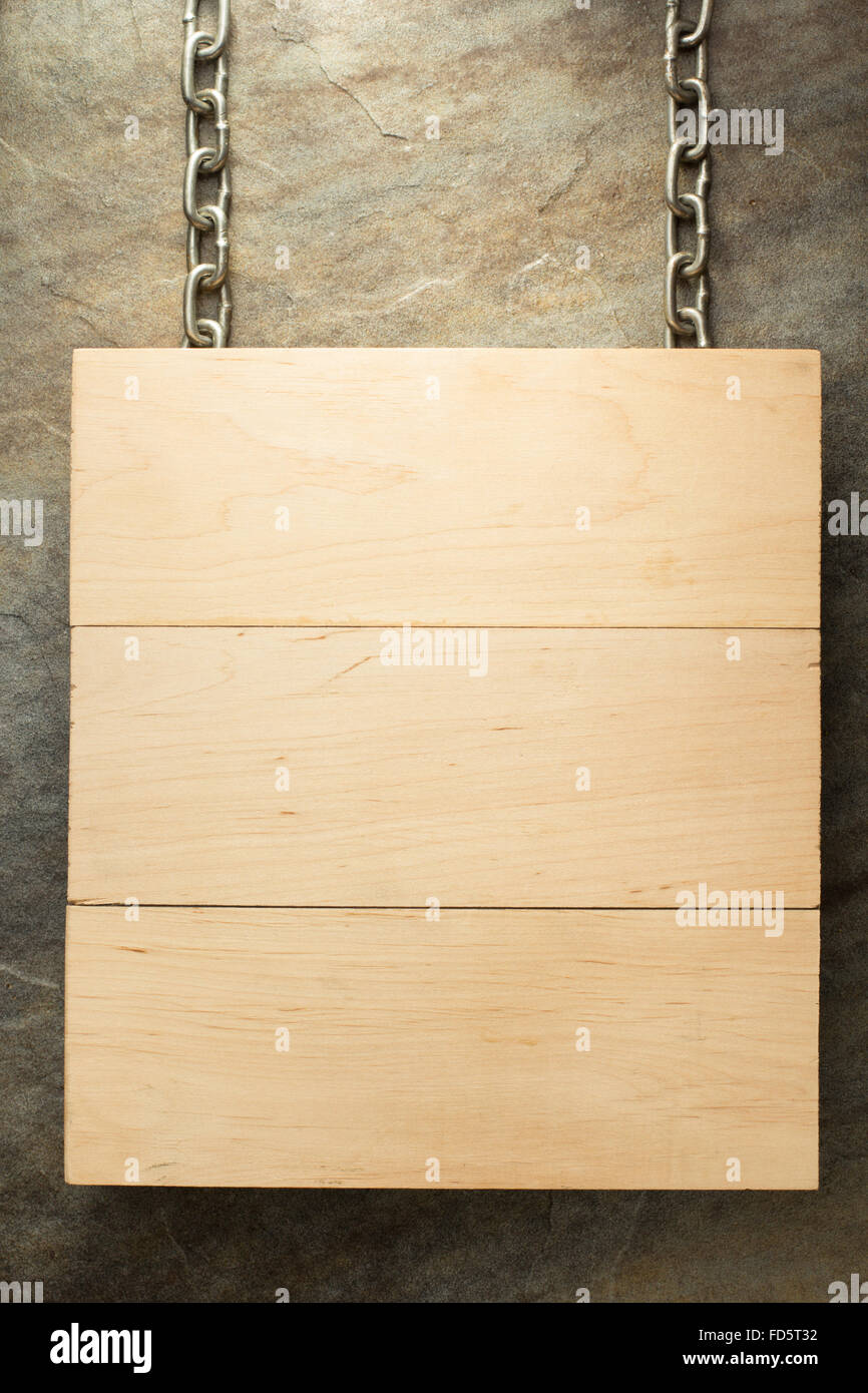 hanging signboard at wall background Stock Photo - Alamy