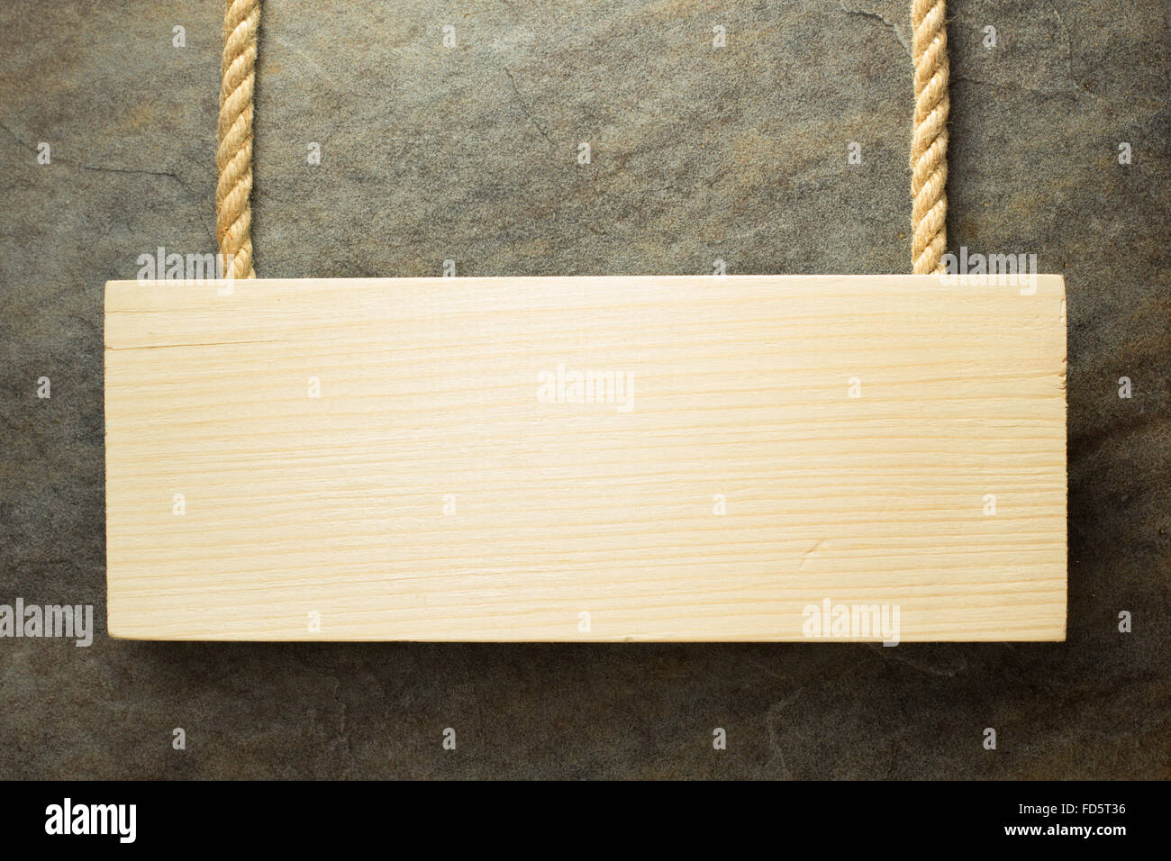 hanging signboard at wall background Stock Photo - Alamy