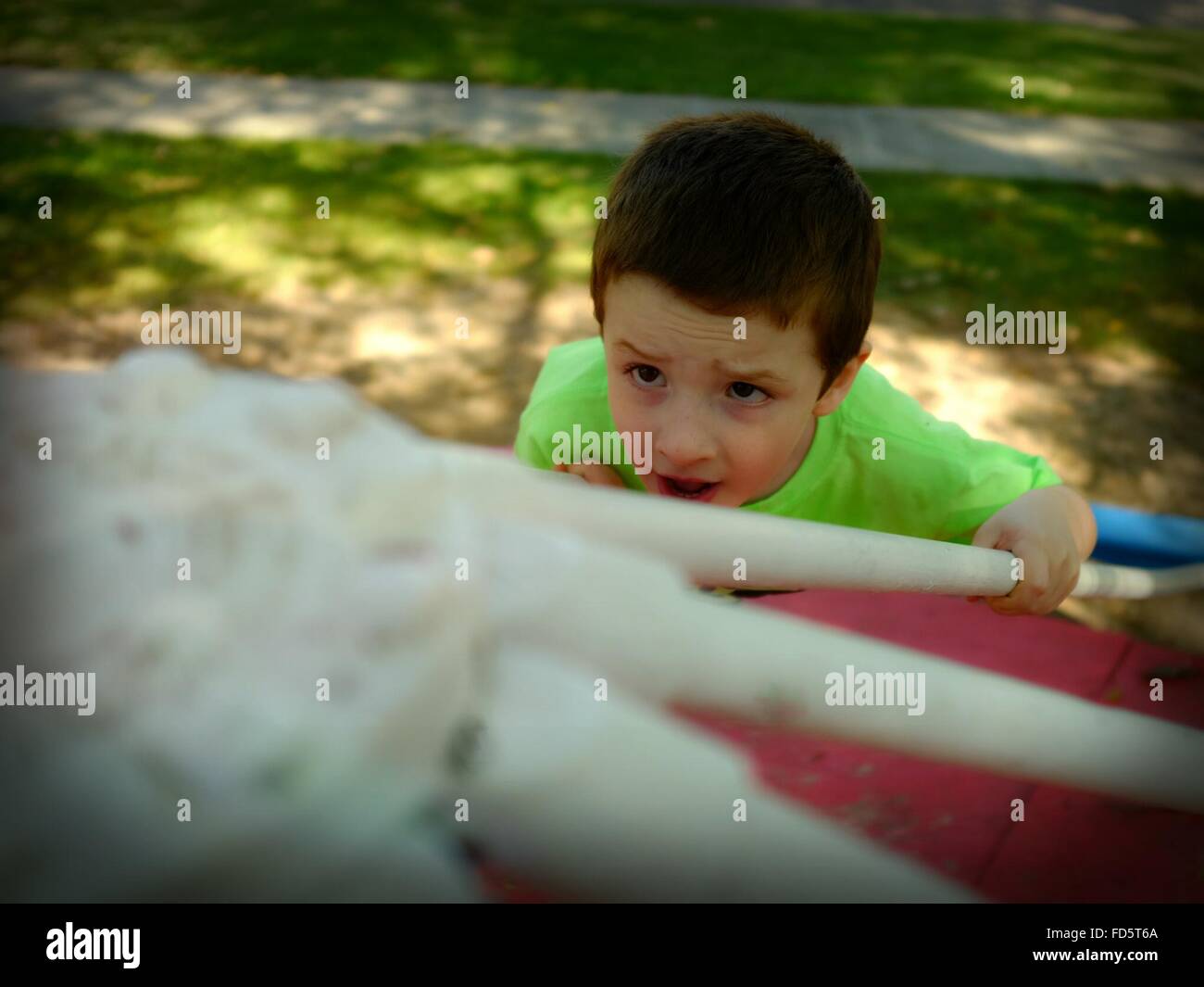 Boys playing in a park hi-res stock photography and images - Alamy
