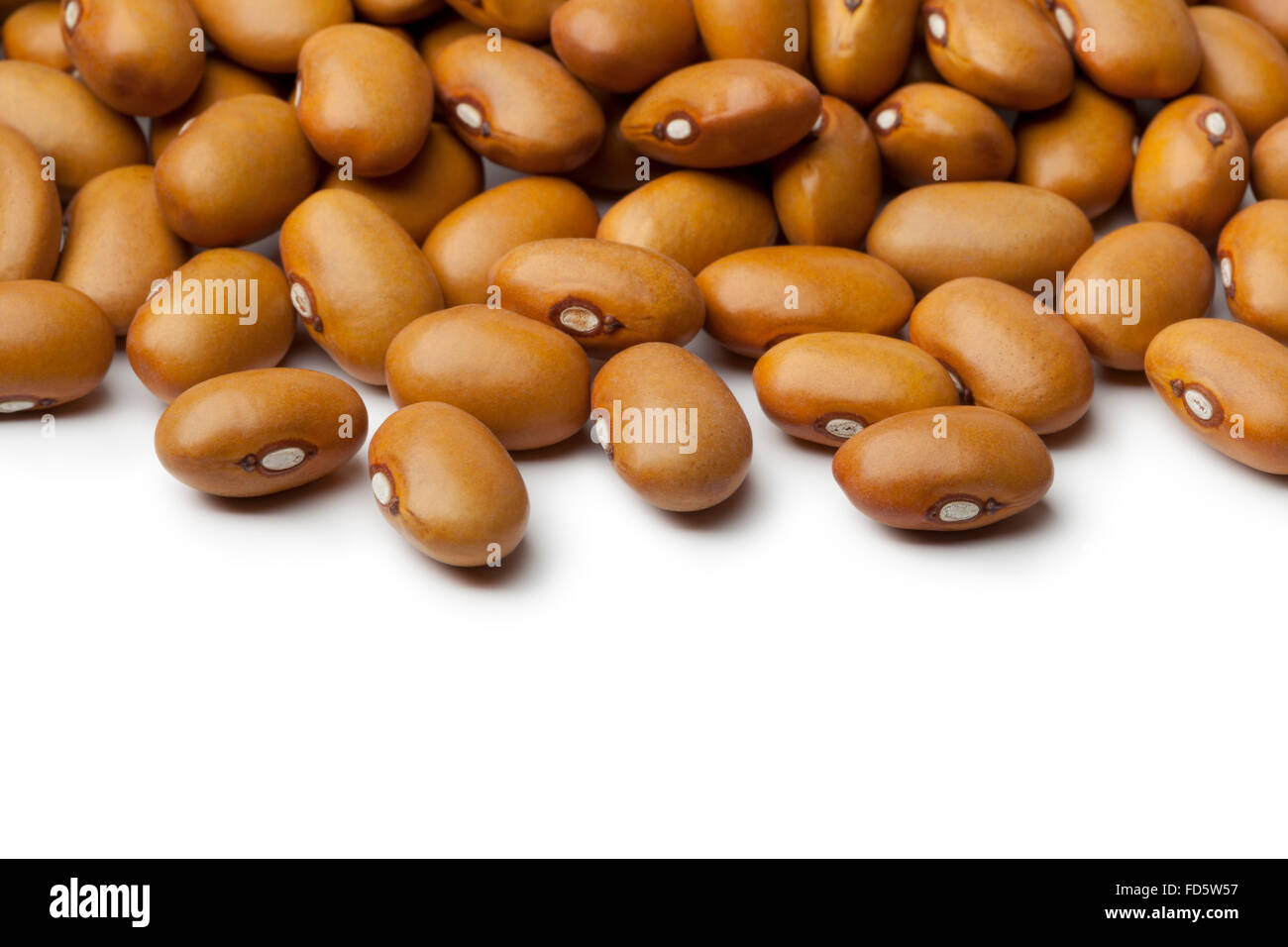 Dried brown beans on white background Stock Photo - Alamy