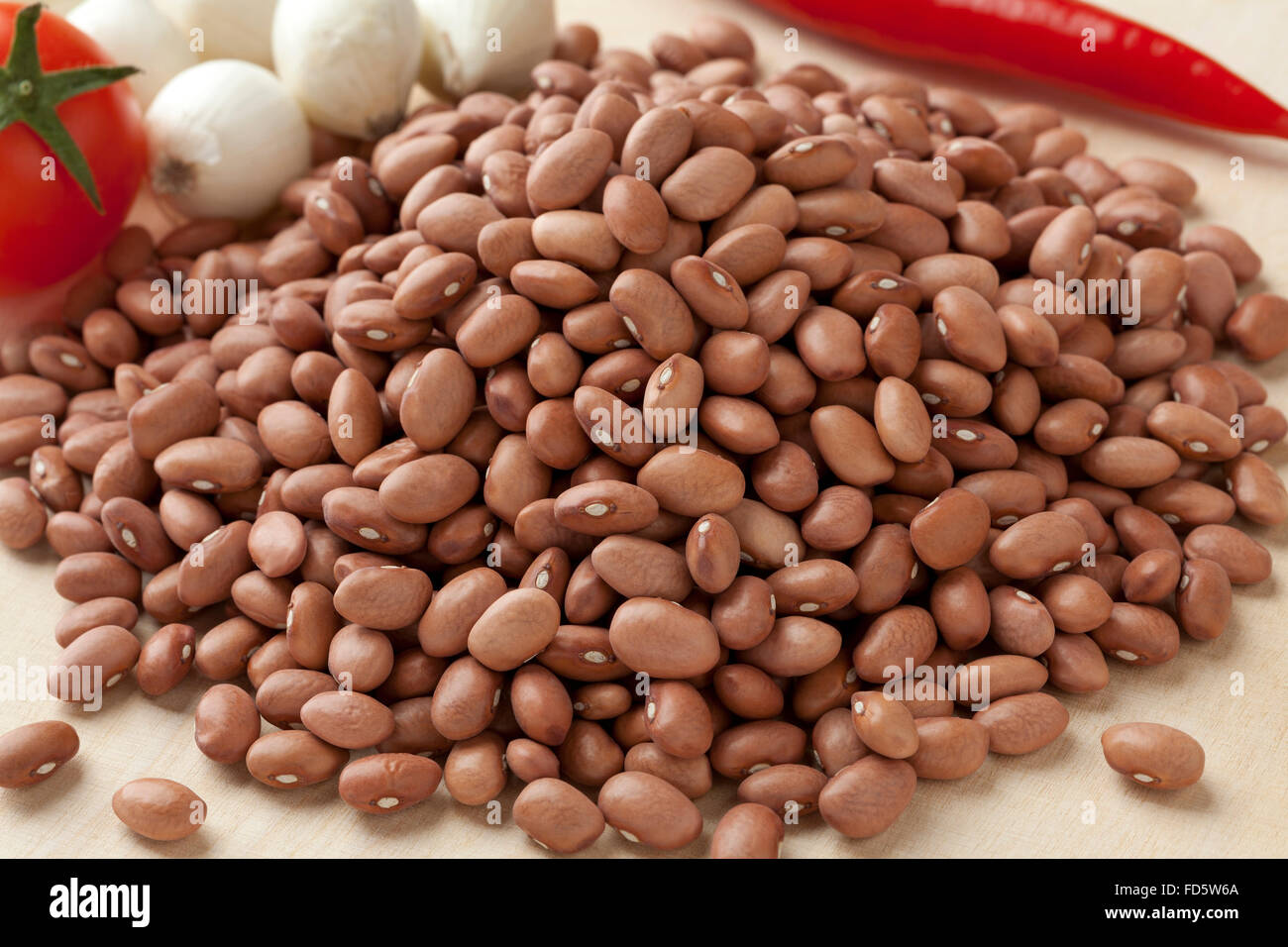Dried pink beans on white background Stock Photo - Alamy