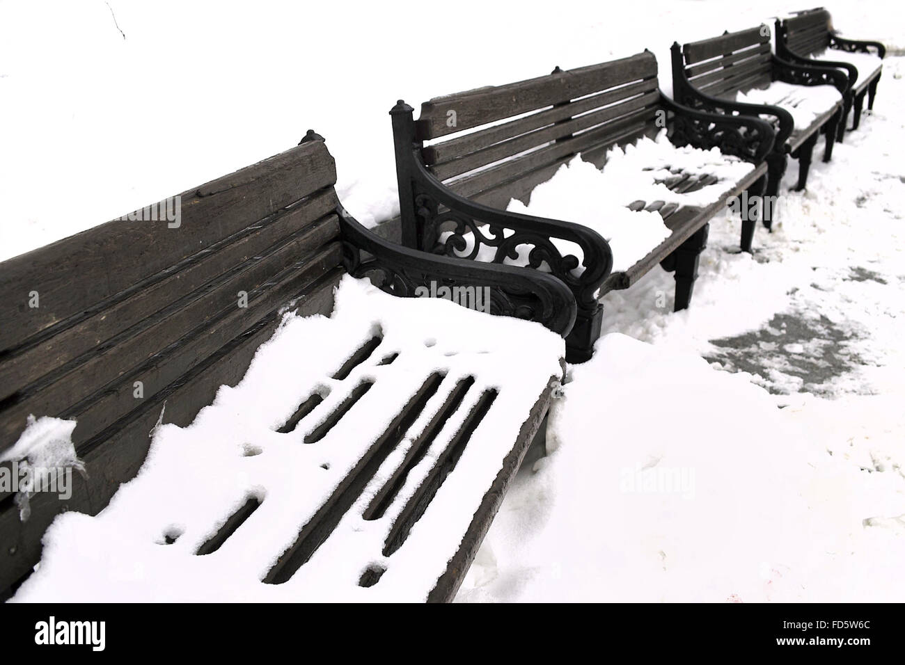 Benches covered with snow Stock Photo - Alamy