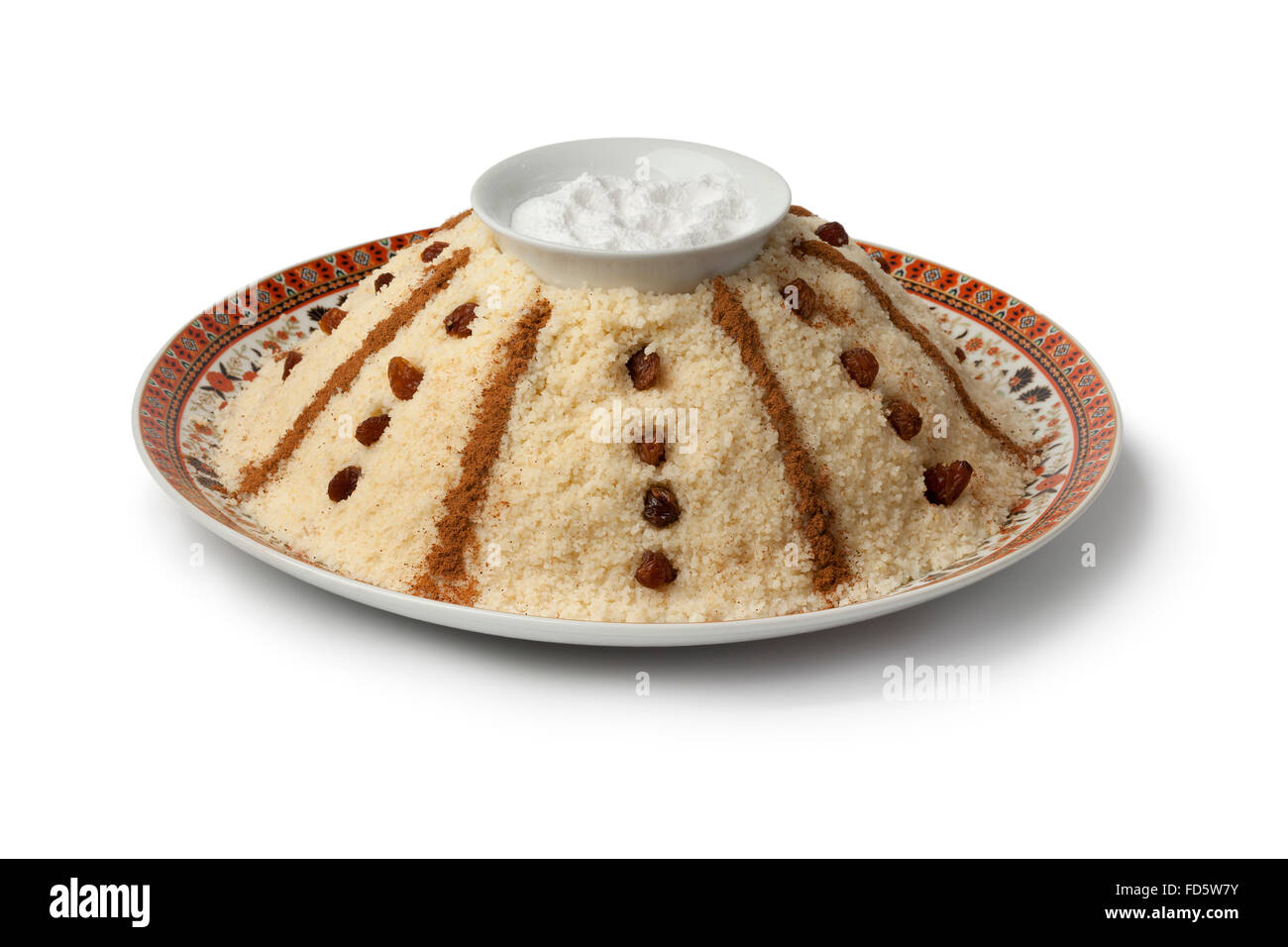 Traditional Moroccan sweet couscous with cinnamon, raisons and sugar on ...