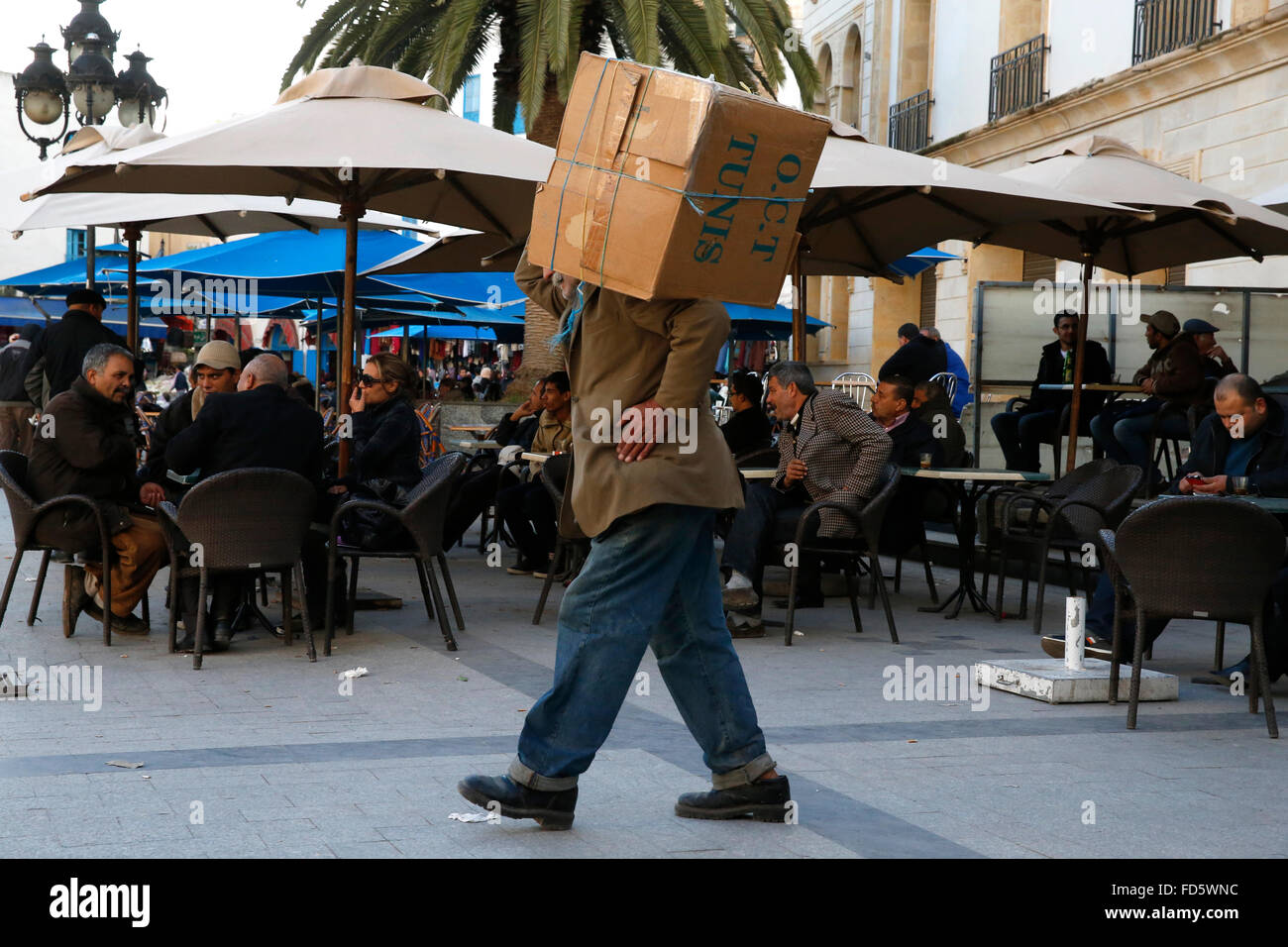 Man carrying a heavy box Stock Photo - Alamy