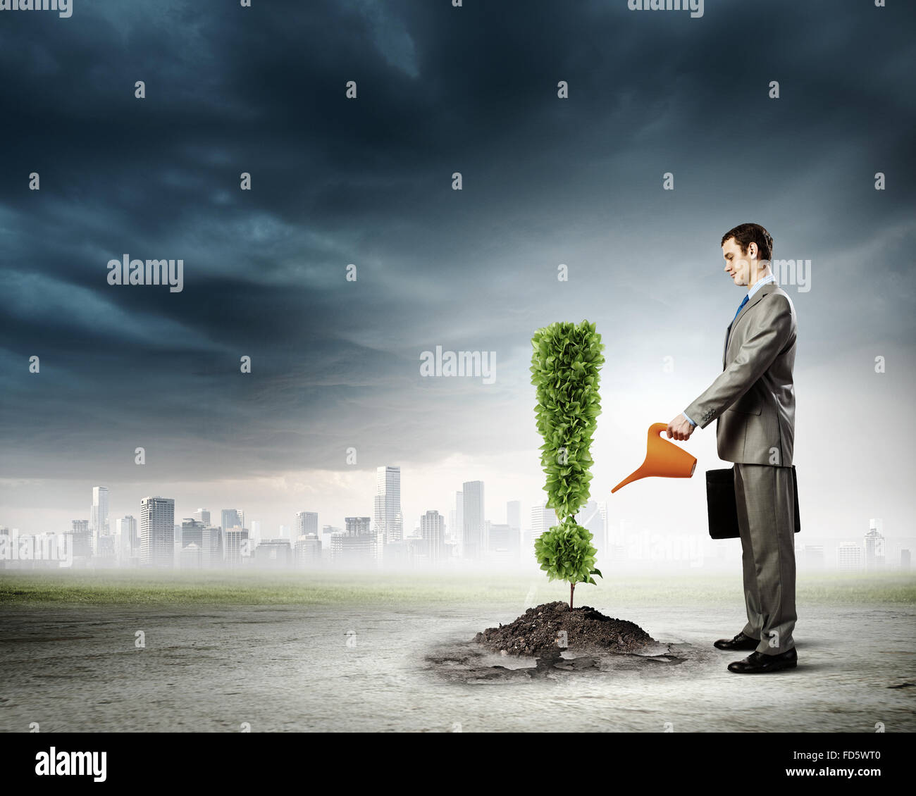 Image of businessman watering plant shaped like exclamation mark Stock ...