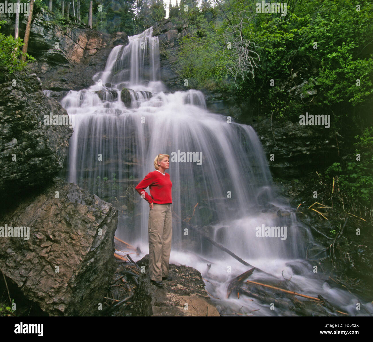 Woman at a waterfall in Vail, Colorado Stock Photo - Alamy