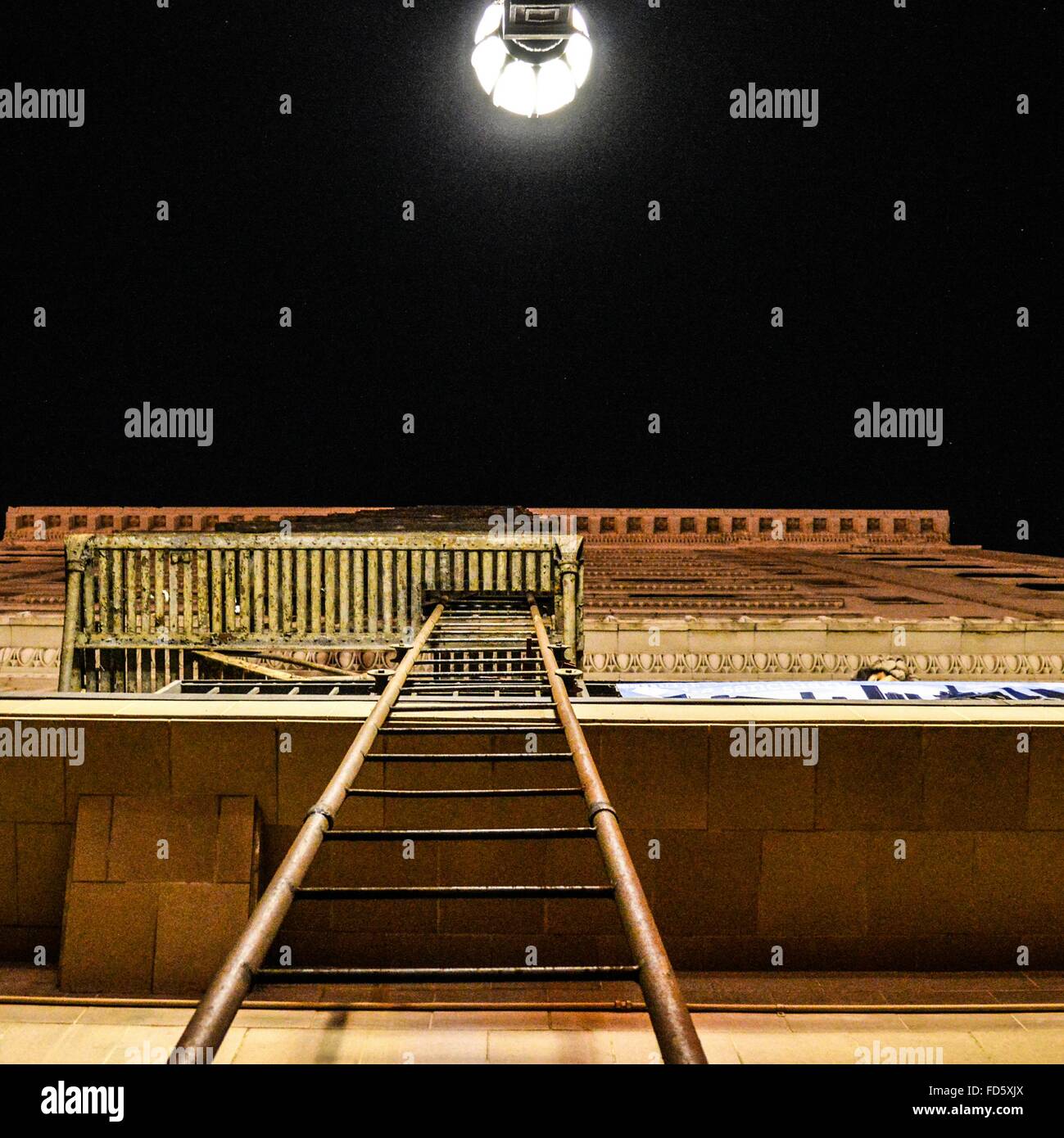 Ladder leaning against building hi-res stock photography and images - Alamy