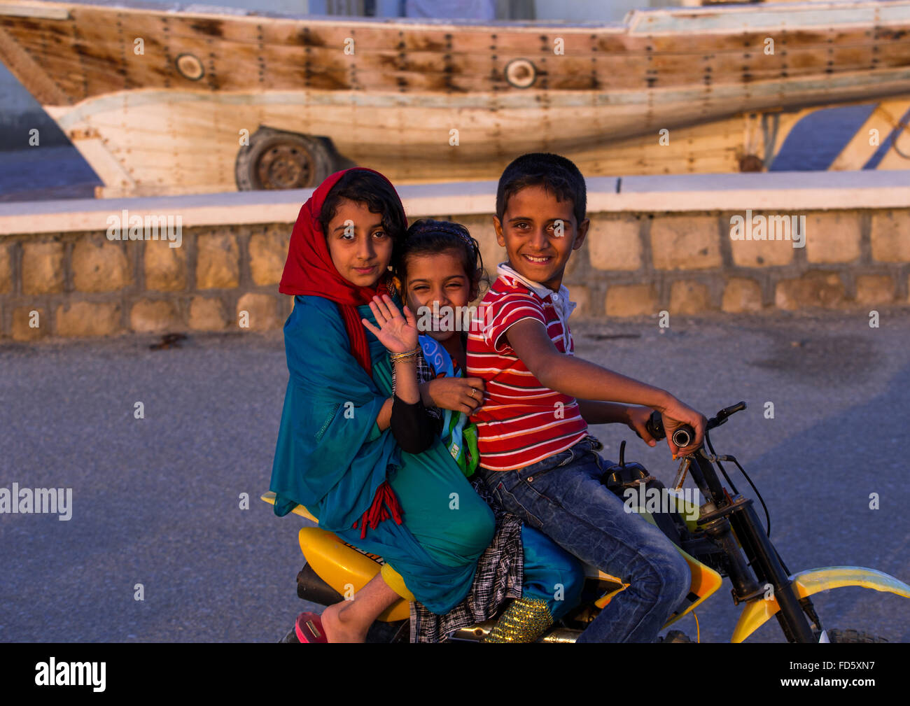 children riding a motorbike, Qeshm Island, Laft, Iran Stock Photo - Alamy