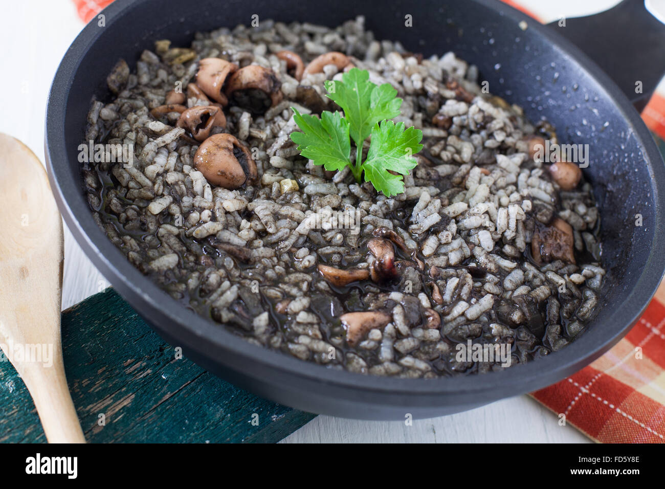 black rissoto with squid and ink sauce Stock Photo - Alamy