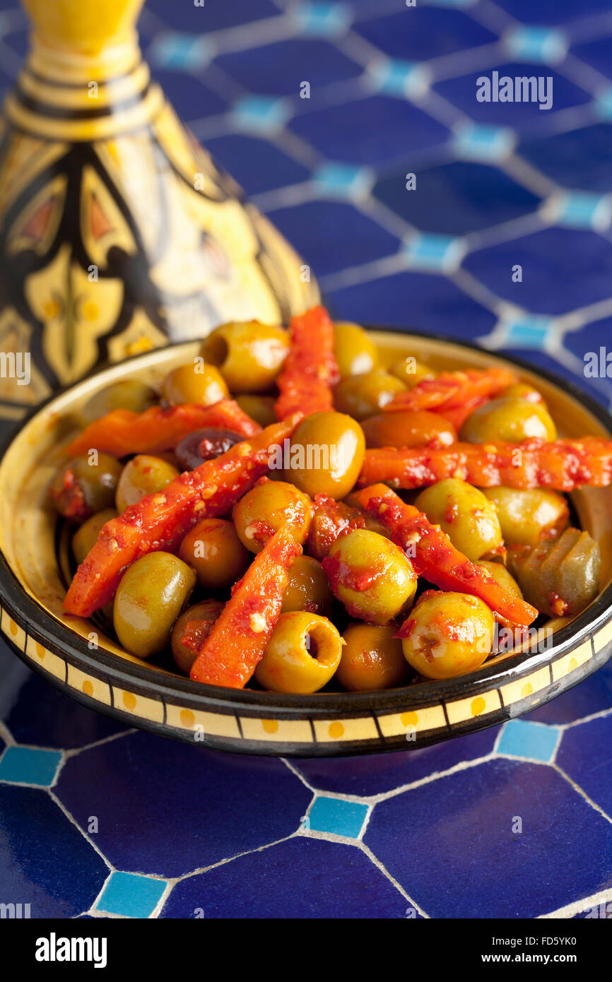 Traditional Moroccan hot harissa olives in a tajine Stock Photo - Alamy