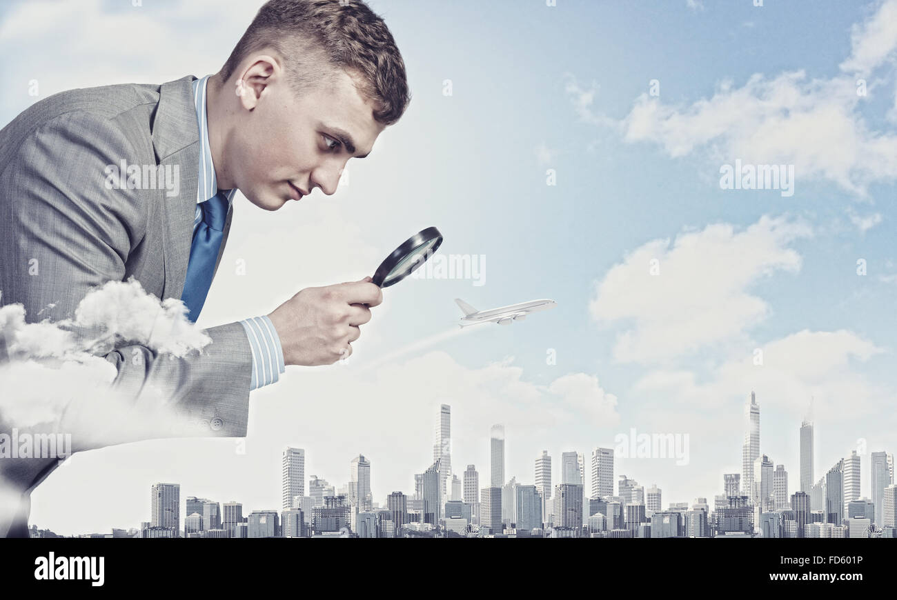 Image of businessman examining objects with magnifier Stock Photo - Alamy
