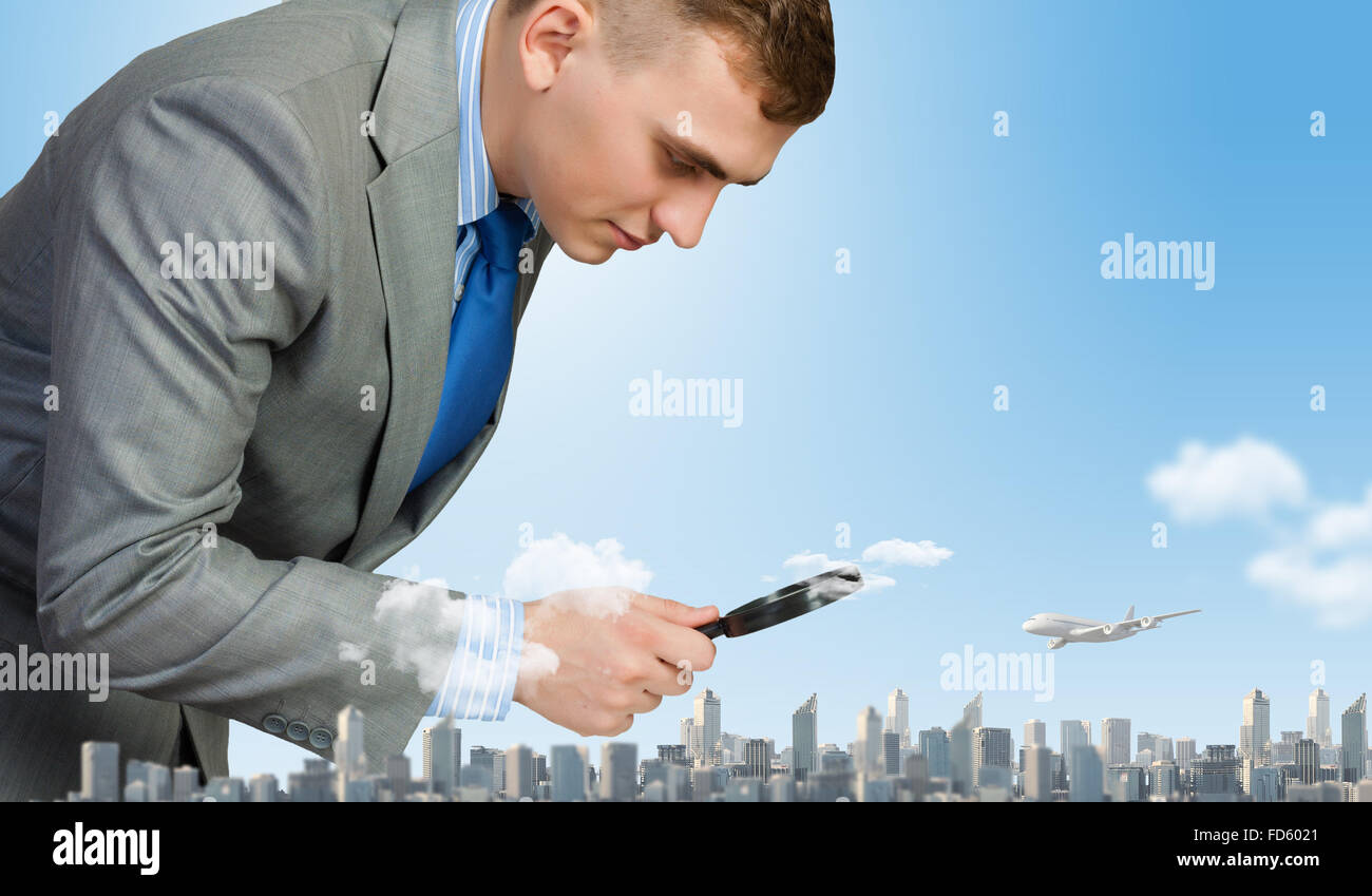 Image of businessman examining objects with magnifier Stock Photo - Alamy