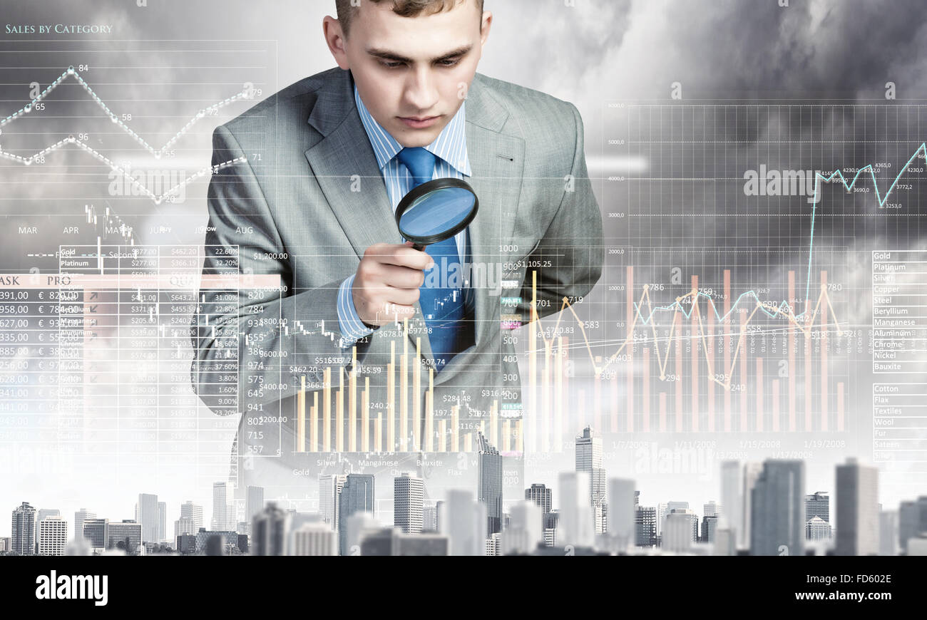 Image of businessman examining objects with magnifier Stock Photo - Alamy