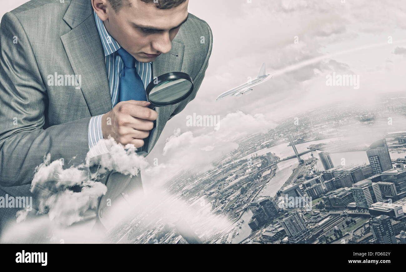 Image of businessman examining objects with magnifier Stock Photo - Alamy