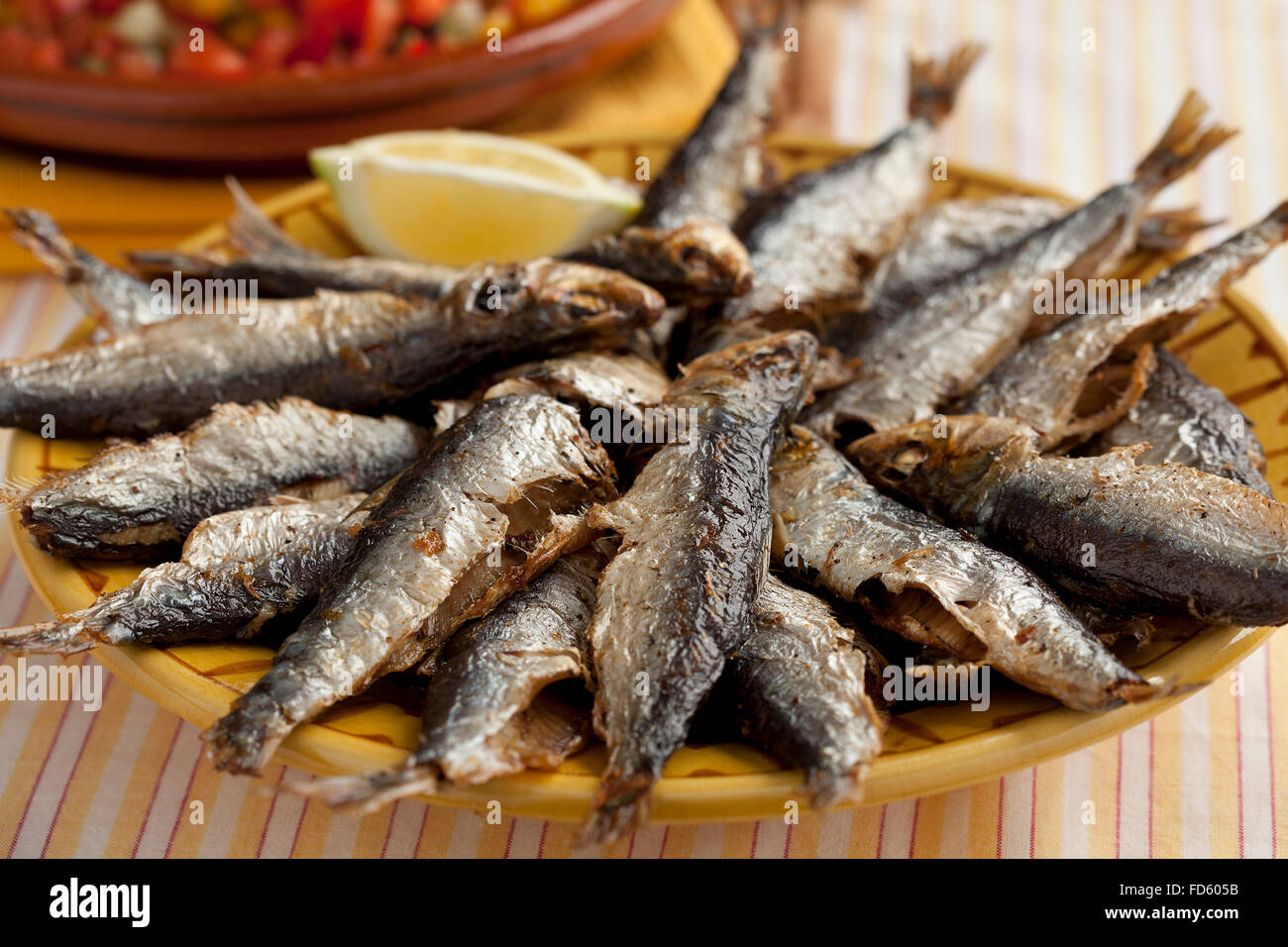 Fresh barbecued sardines on a dish Stock Photo - Alamy