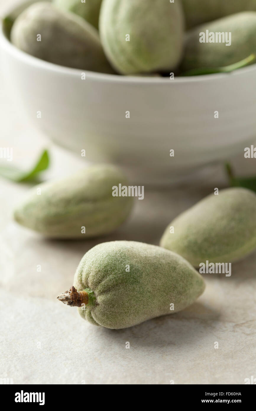 Whole fresh raw green almonds Stock Photo - Alamy