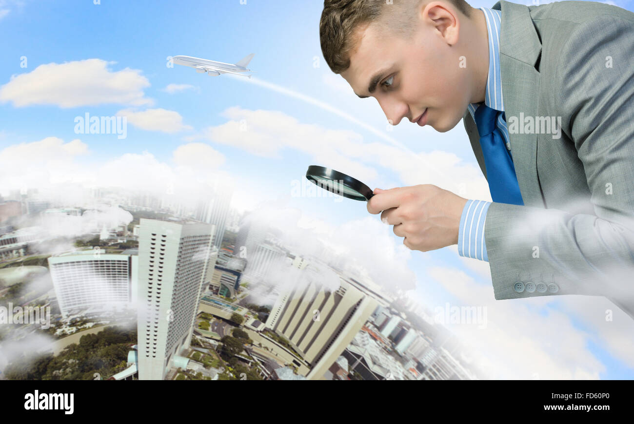 Image of businessman examining objects with magnifier Stock Photo - Alamy