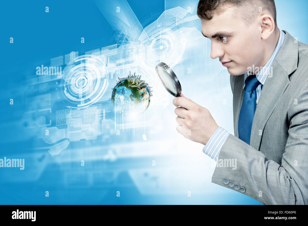 Magnifying glass examining earth hi-res stock photography and images ...