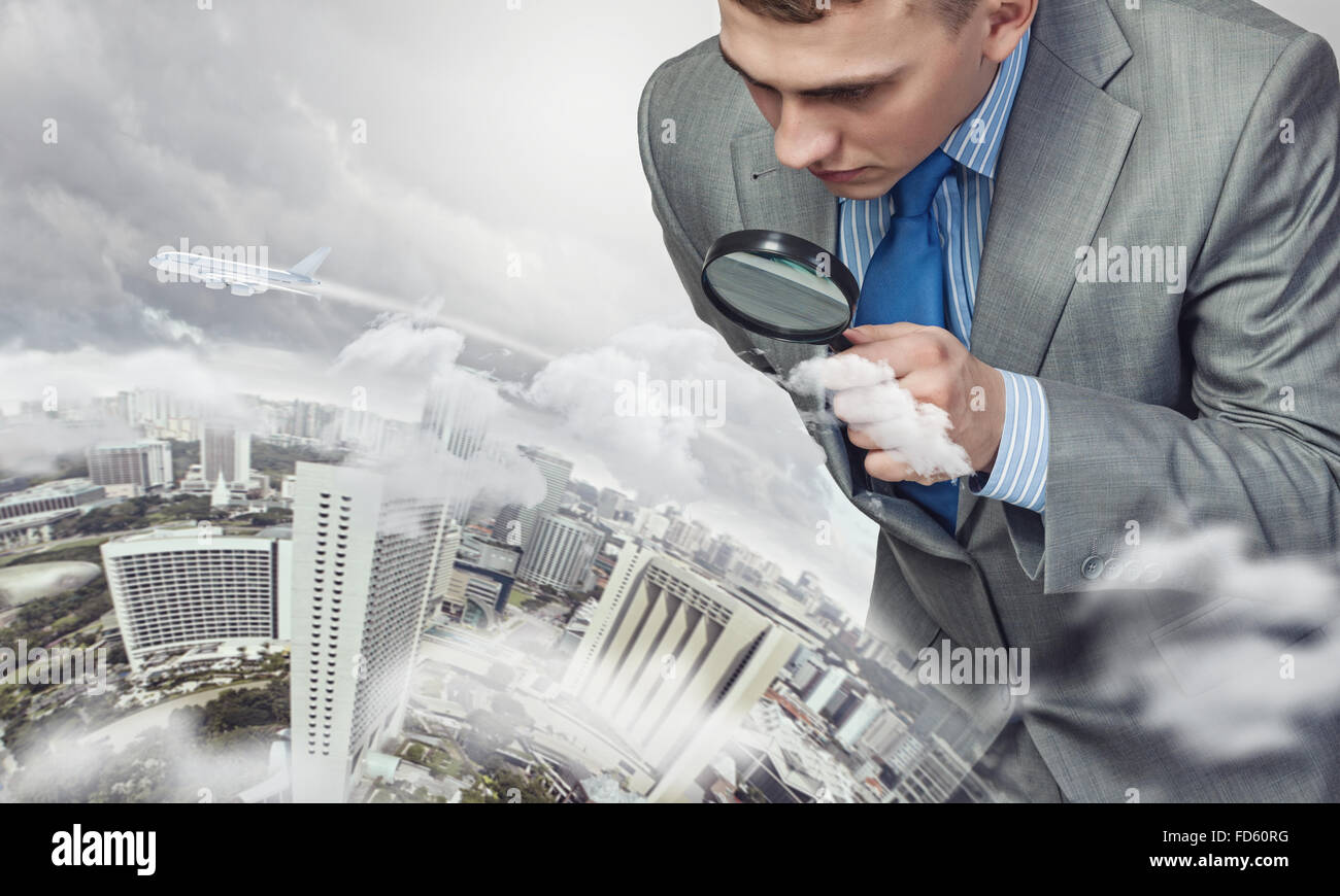 Image of businessman examining objects with magnifier Stock Photo - Alamy