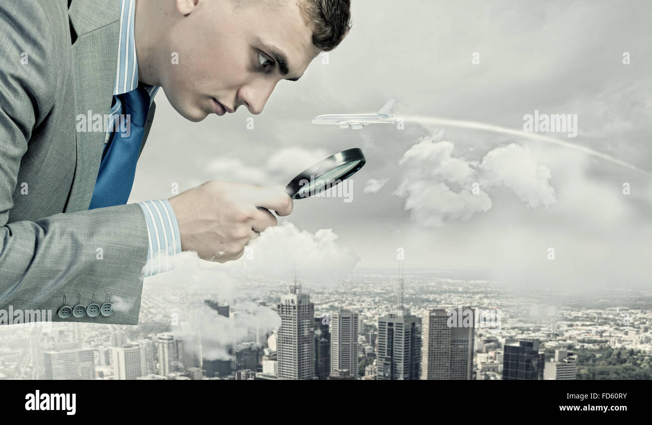 Image of businessman examining objects with magnifier Stock Photo - Alamy