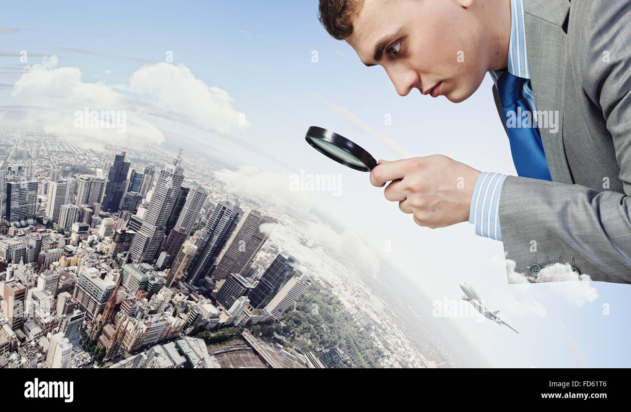 Image of businessman examining objects with magnifier Stock Photo - Alamy